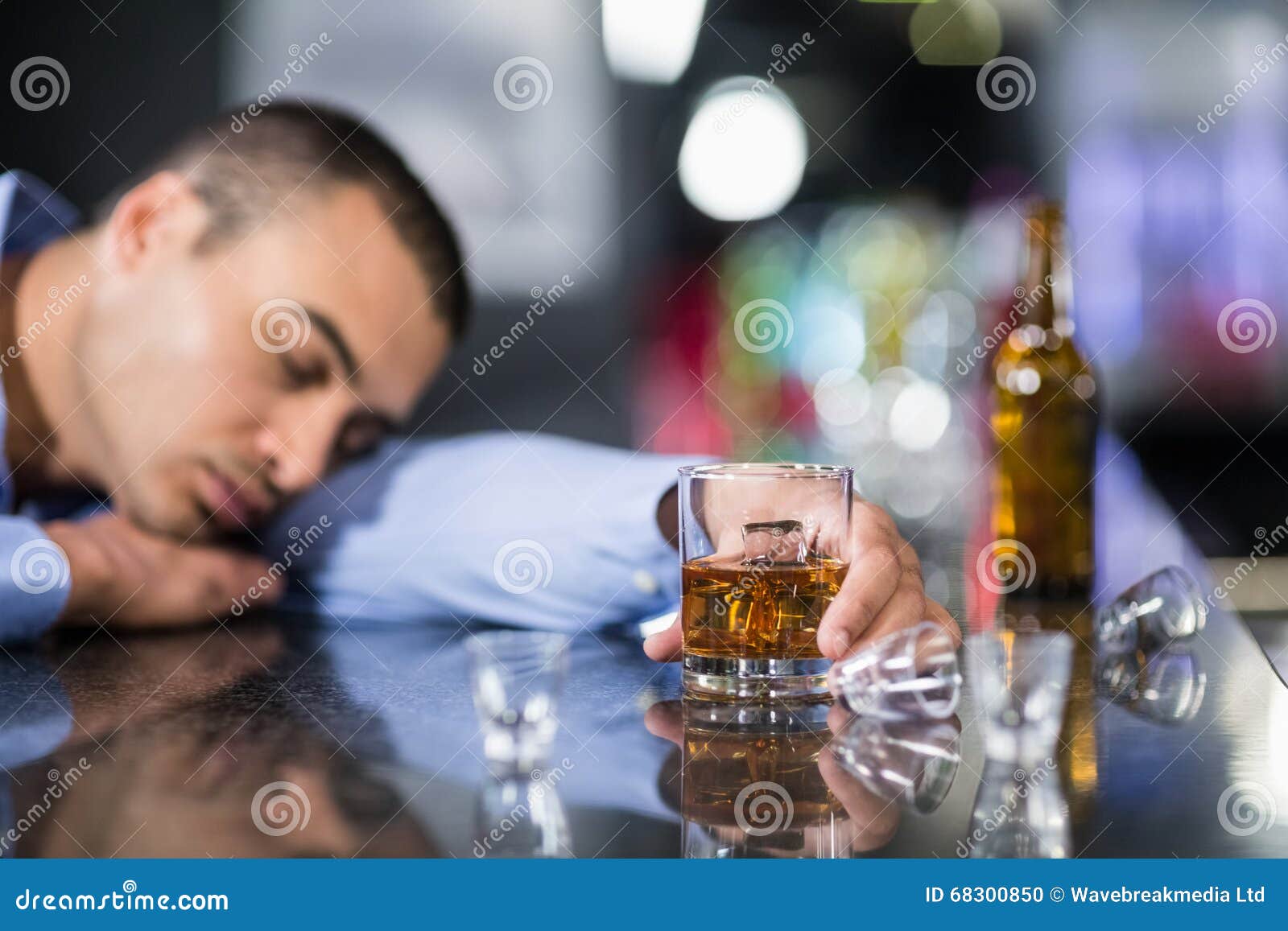 Tired Man Having a Whiskey and Sleeping on a Counter Stock Photo ...