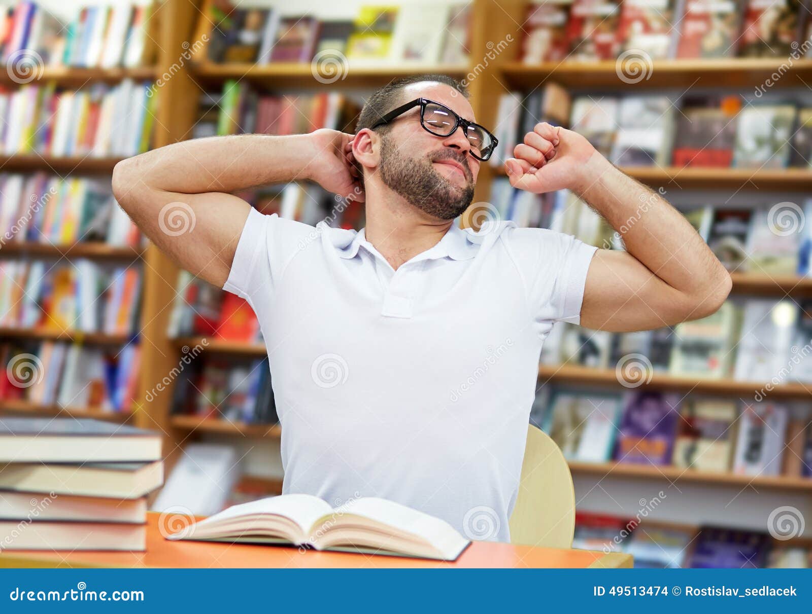 Tired man in the library stock photo. Image of high, lifestyle - 49513474