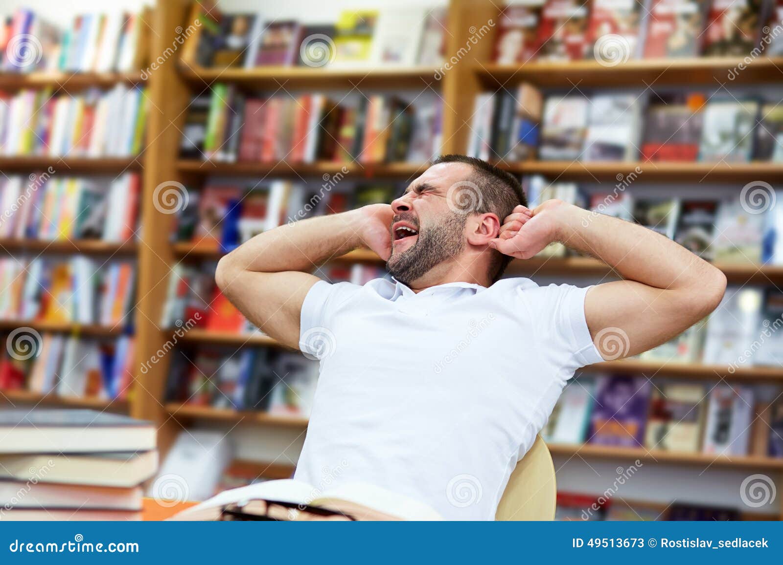 Tired man in the library stock image. Image of people - 49513673