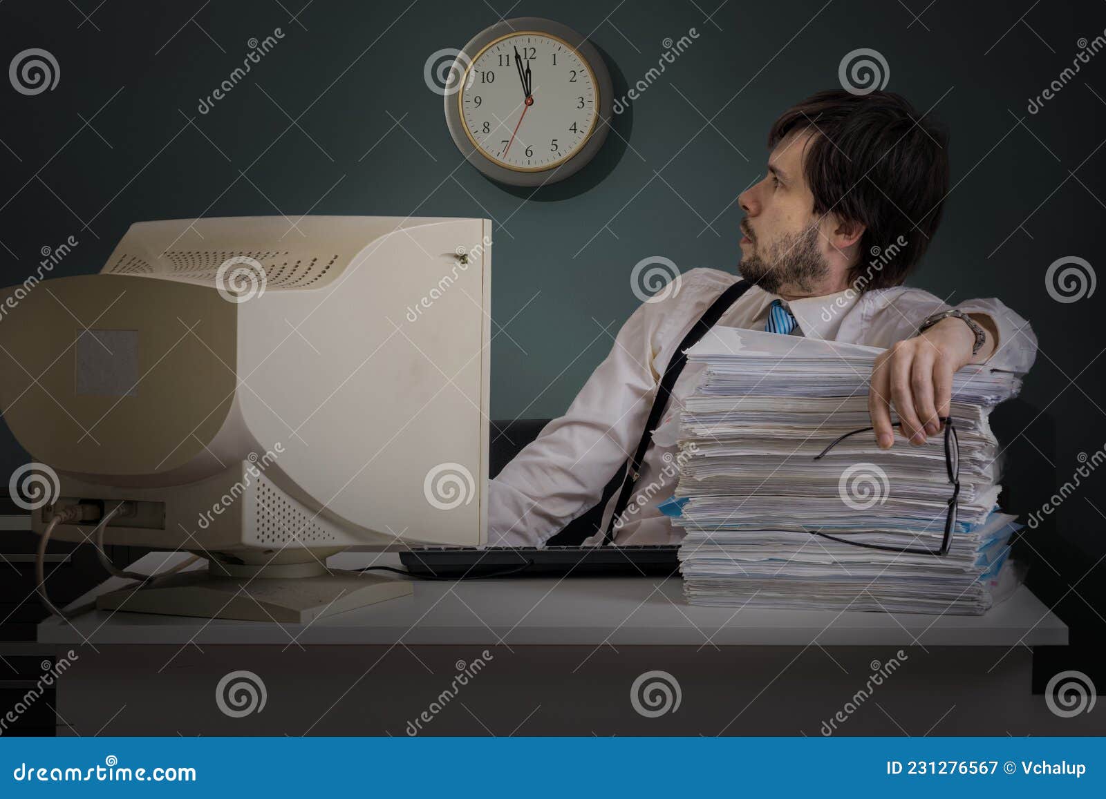 Tired Man is Looking on Clock in Office at Night. Overwork Concept ...