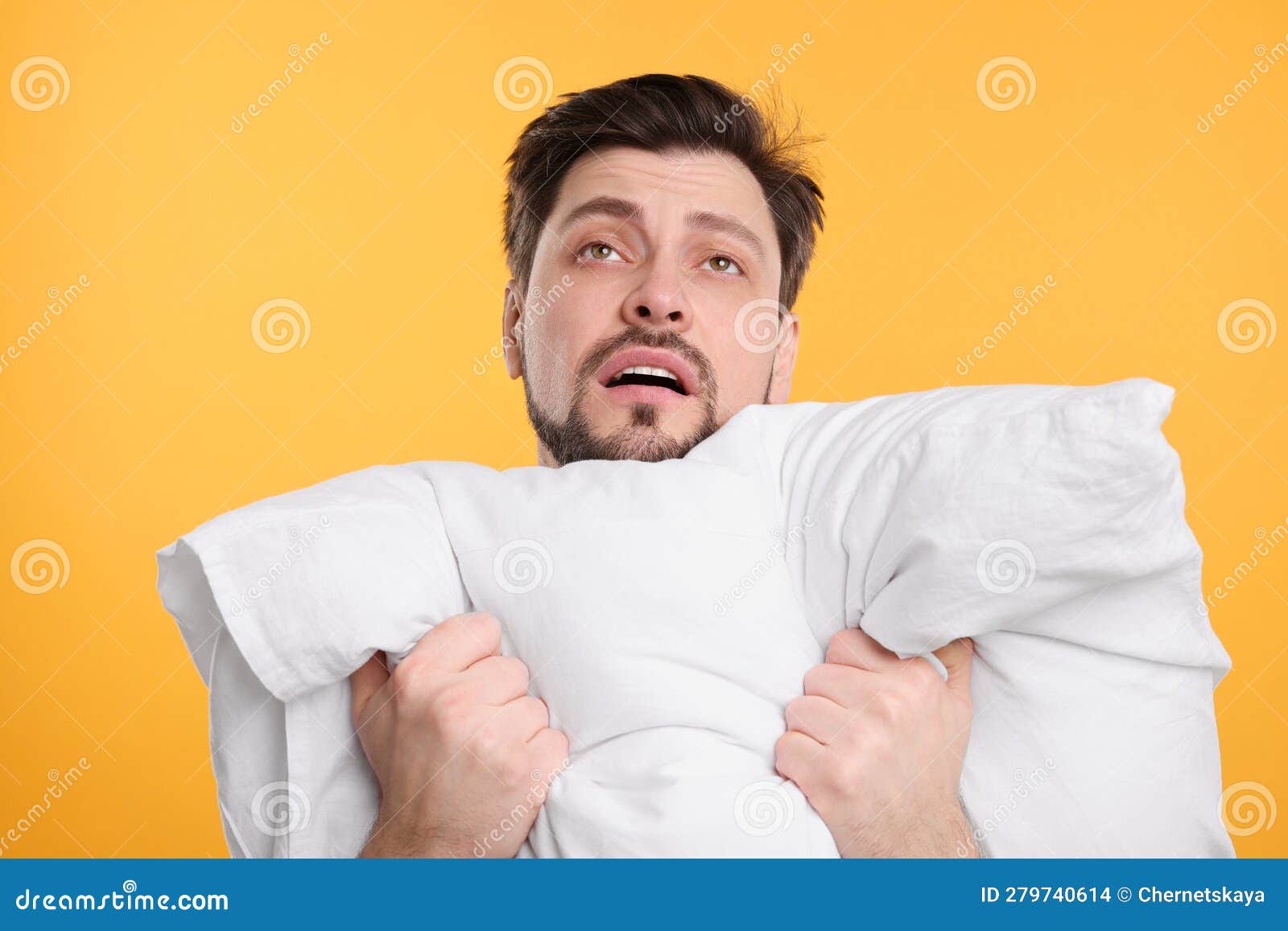 Tired Man with Pillow on Yellow Background. Insomnia Problem Stock ...