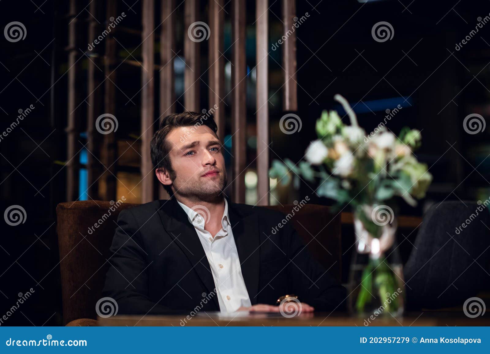 A Tired Man Sits at a Table in a Restaurant after Work Stock Image ...