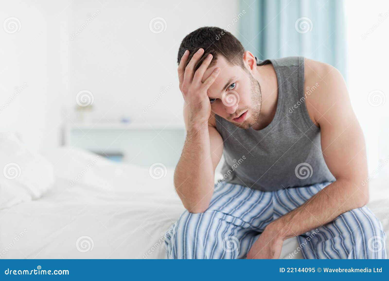 Tired Man Sitting on His Bed Stock Image - Image of serious, gesture ...