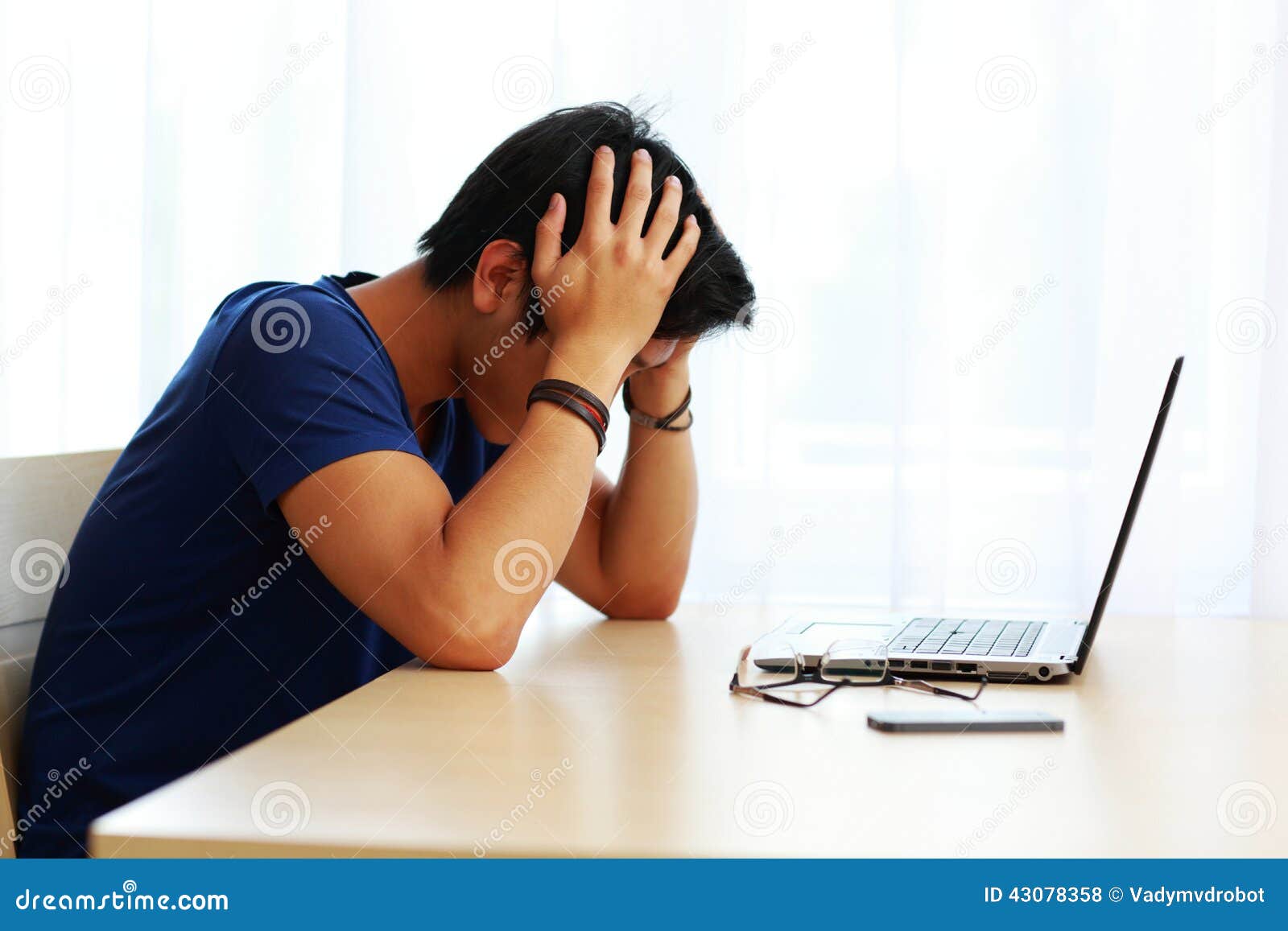 Tired Man Sitting at the Table with Laptop Stock Photo - Image of ...