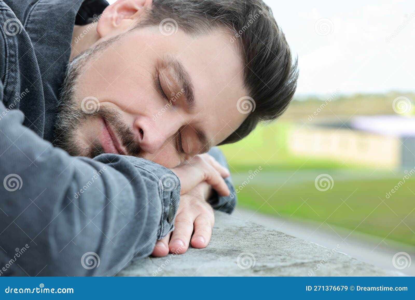 Tired Man Sleeping on Stone Parapet Outdoors, Closeup. Space for Text ...