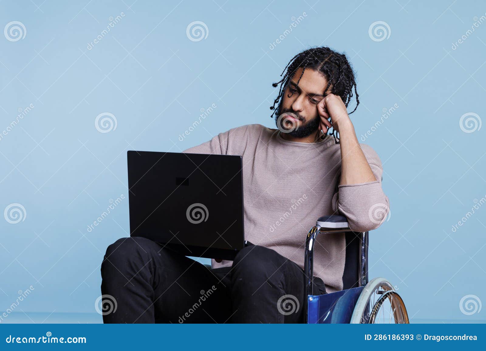Tired Man in Wheelchair Typing on Laptop, Working Remotely Stock Image ...