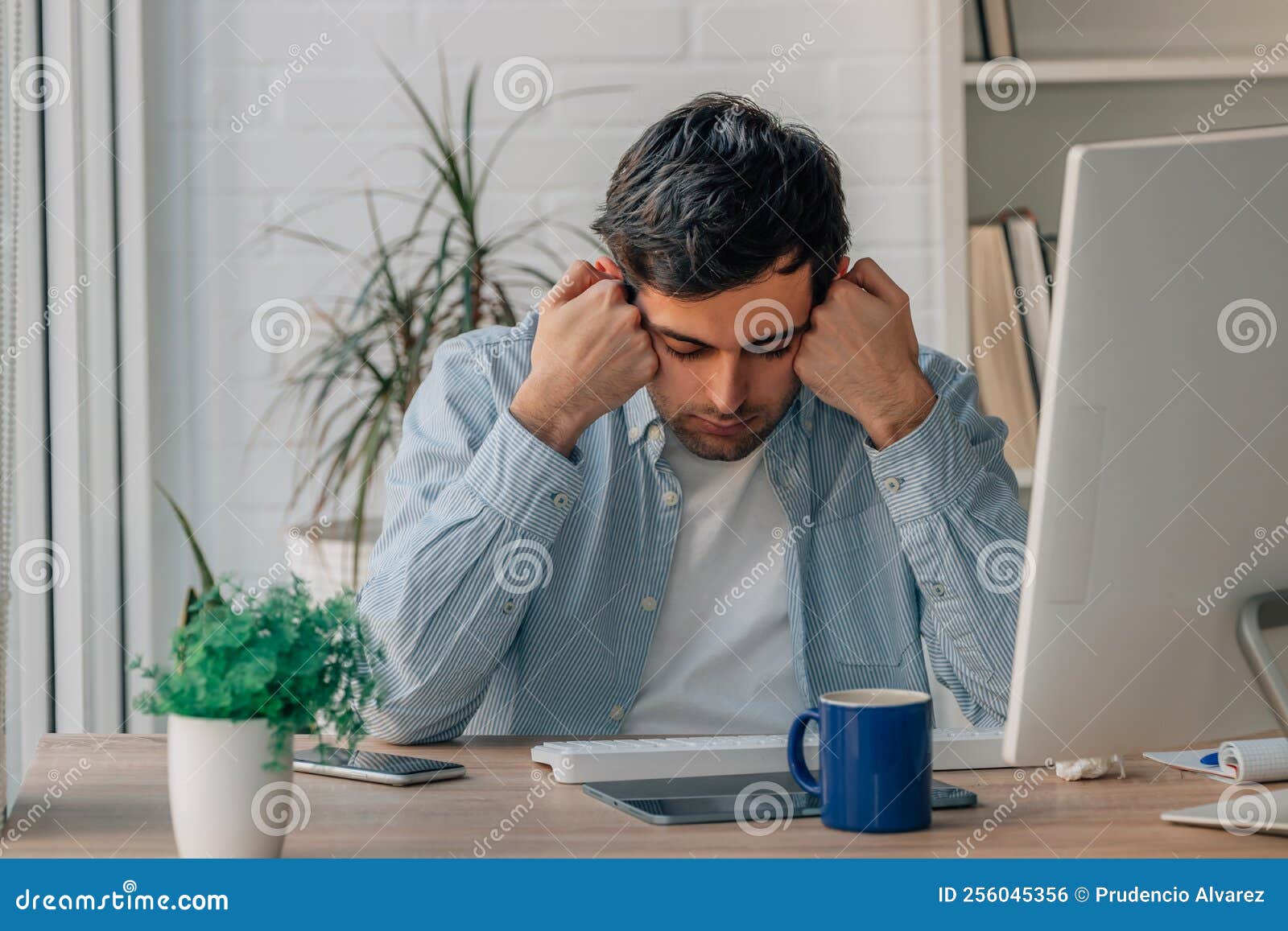 Tired man working at home stock photo. Image of fatigue - 256045356