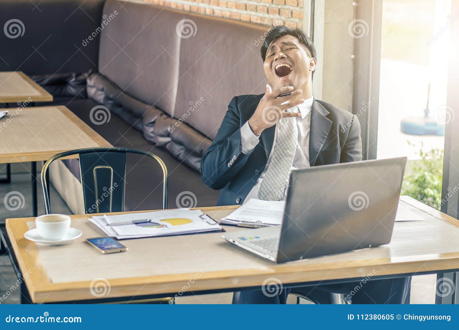 Tired Man Yawning at Workplace Stock Image - Image of indoors, business ...