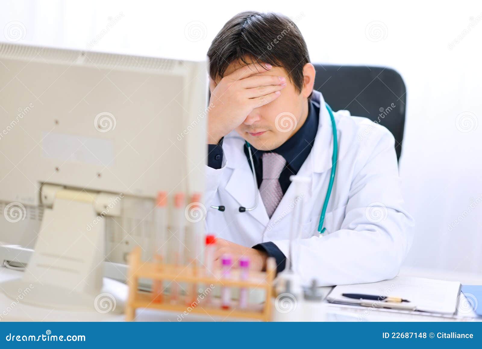 Tired Medical Doctor Working on Computer at Office Stock Photo - Image ...