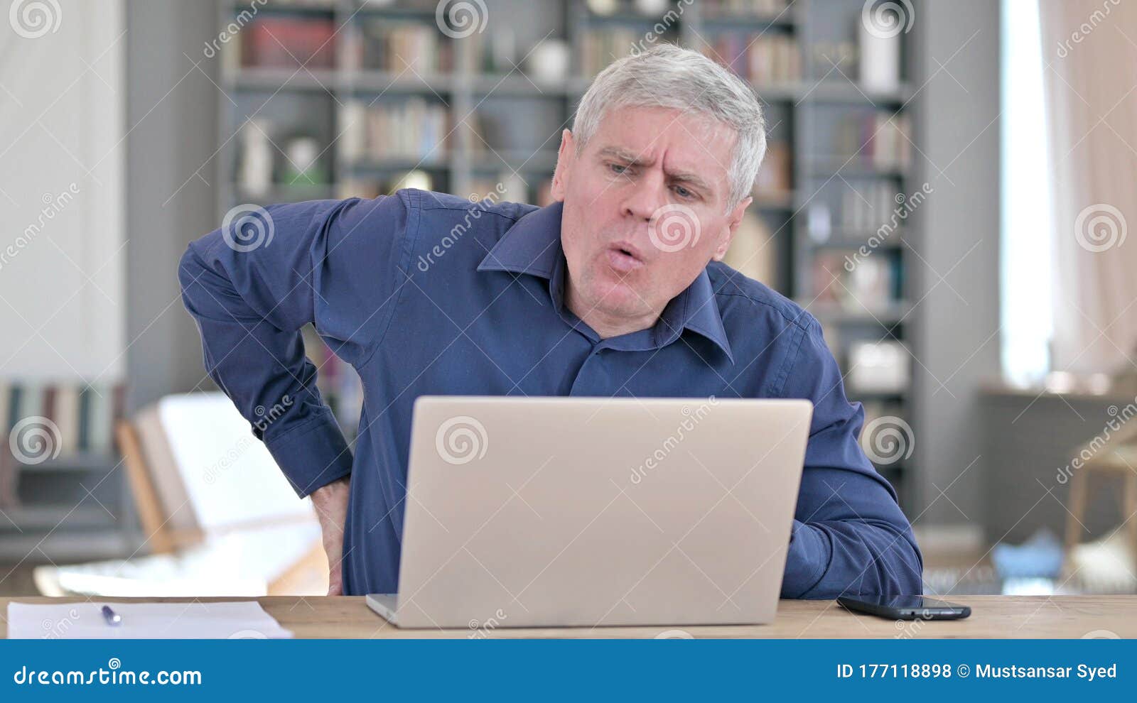 Tired Middle Aged Man Having Back Pain while Working on Laptop Stock ...