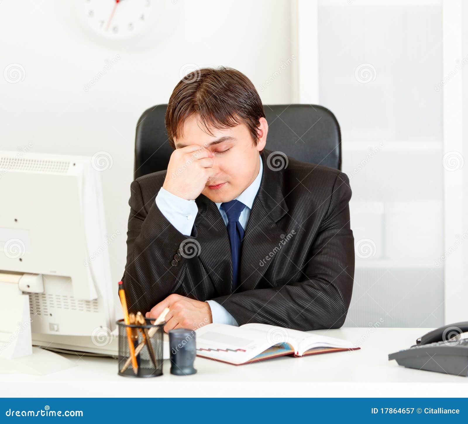 Tired Modern Businessman Sitting at Office Desk Stock Image - Image of ...
