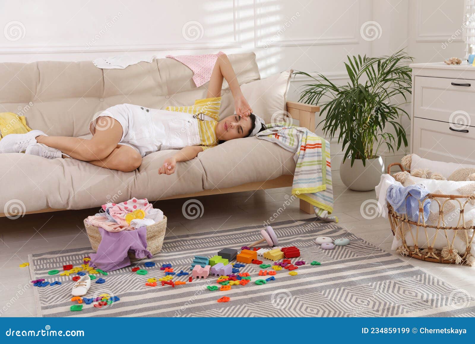 Tired Young Mother Sleeping on Sofa in Messy Living Room Stock Image ...