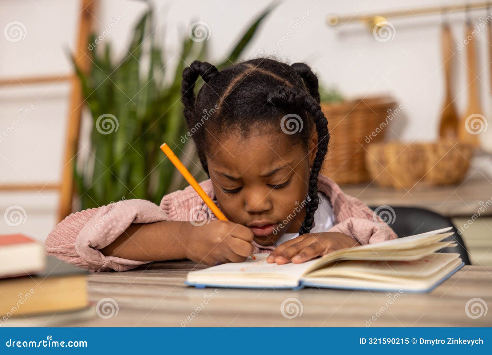 Tired Multicultural Girl Writing in Her Exercise Book with Sad ...