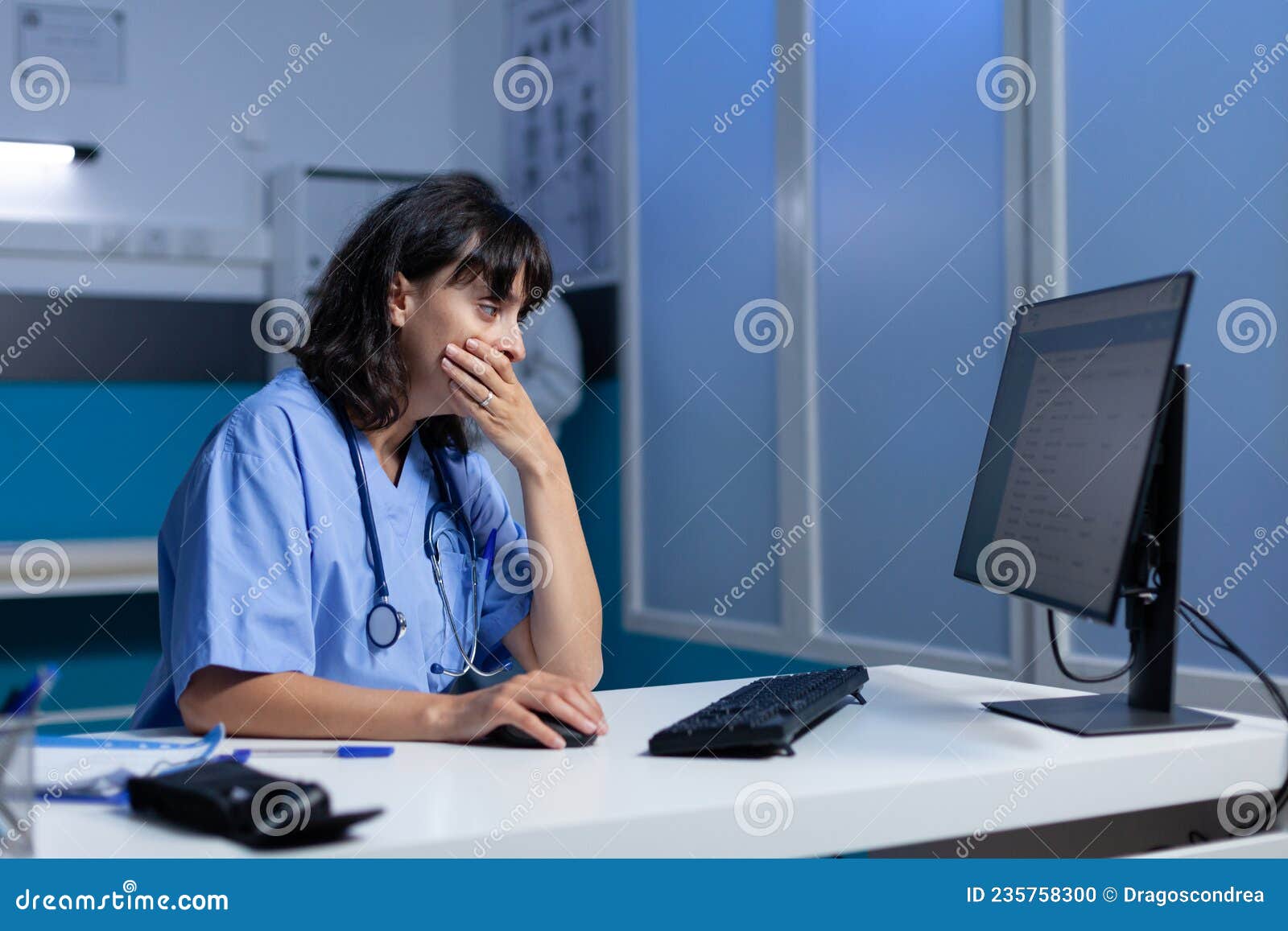 Tired Nurse Using Computer on Desk while Falling Asleep Stock Photo ...