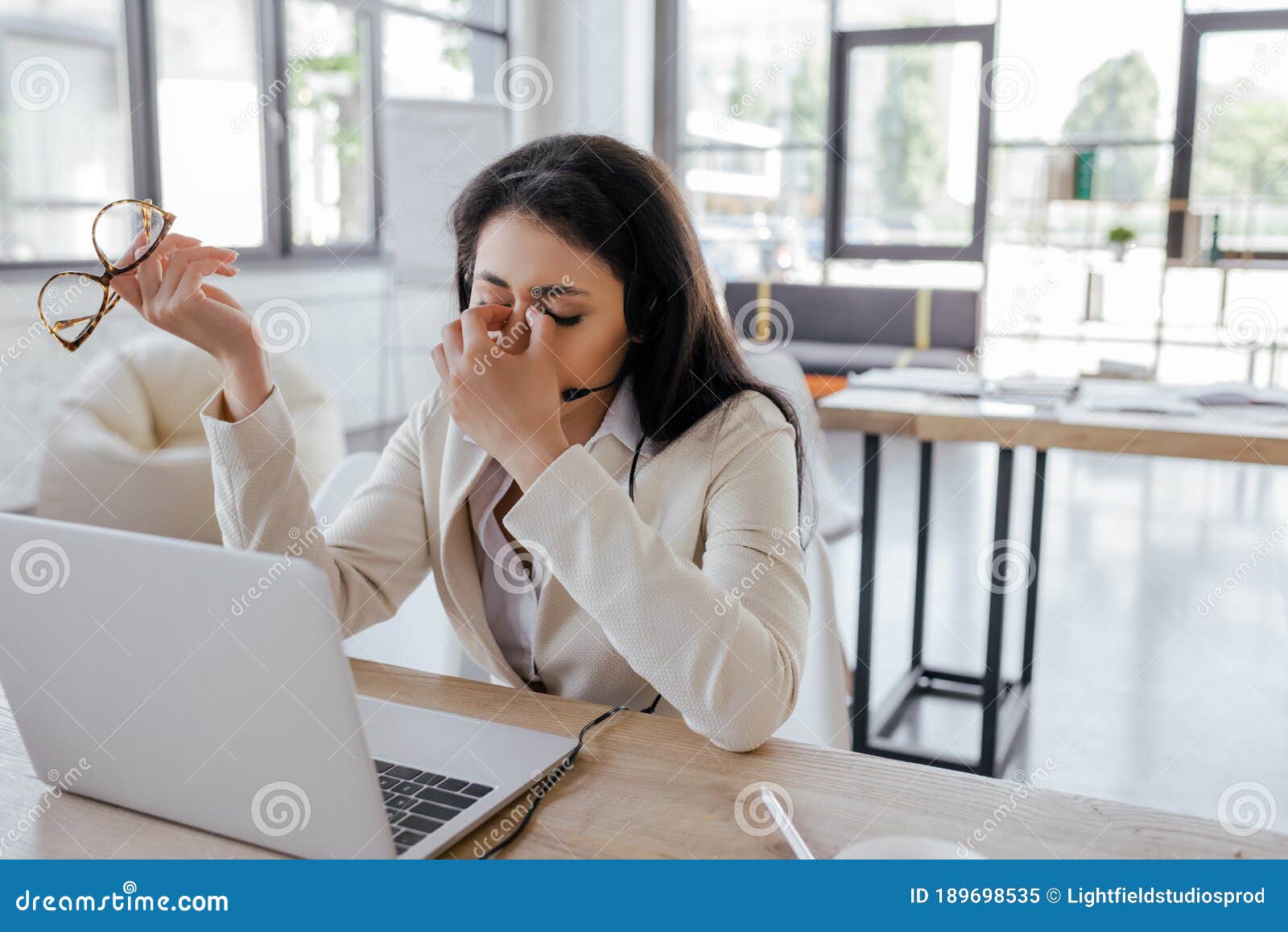 Tired Operator in Headset Touching Eyes Stock Image - Image of ...