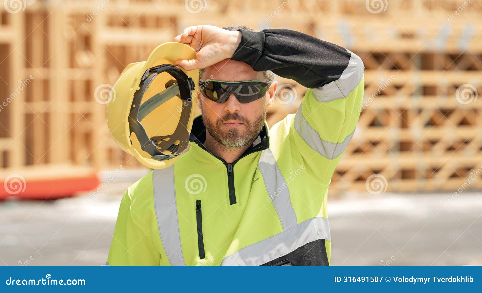 Tired, Overworked Worker in Building Uniform on Buildings Construction ...