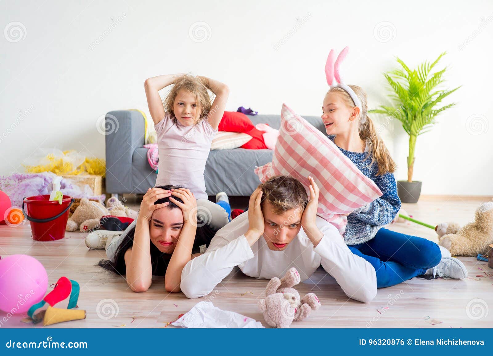 Tired Parents and Romping Kids Stock Photo - Image of housekeeper, romp ...