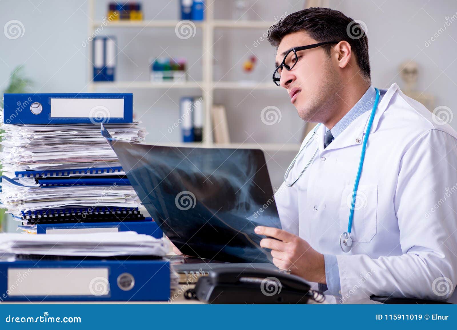The Tired Radiologist with X-ray Image in Hospital Stock Image - Image ...
