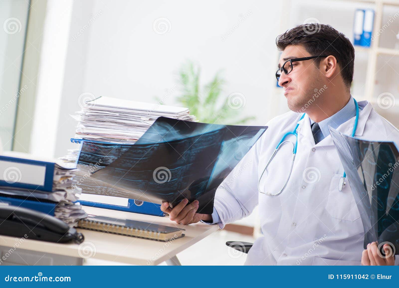 The Tired Radiologist with X-ray Image in Hospital Stock Photo - Image ...