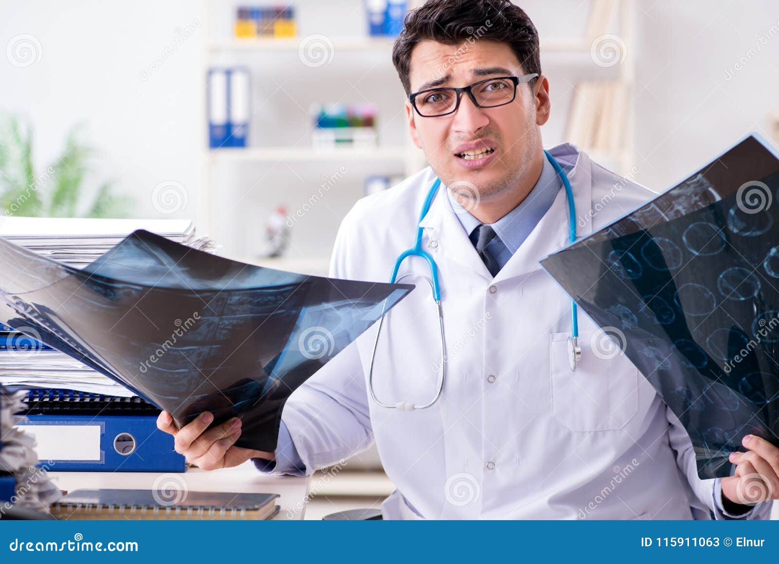 The Tired Radiologist with X-ray Image in Hospital Stock Image - Image ...