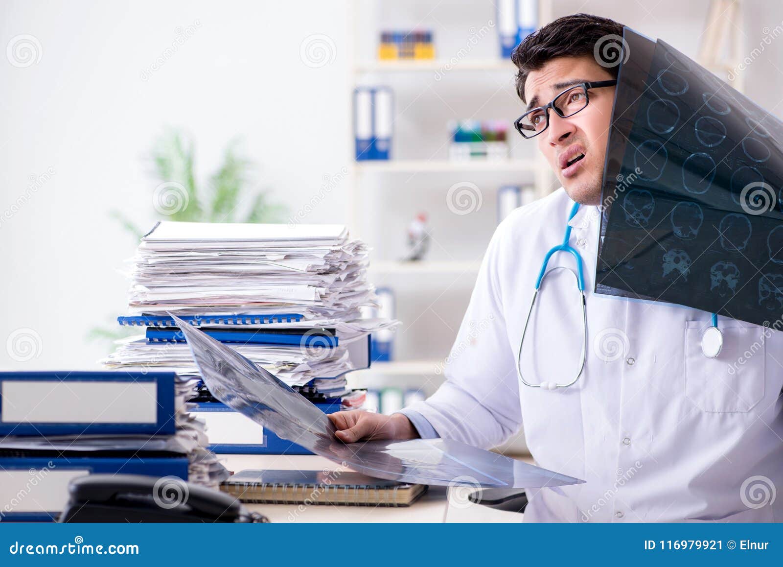 The Tired Radiologist with X-ray Image in Hospital Stock Image - Image ...