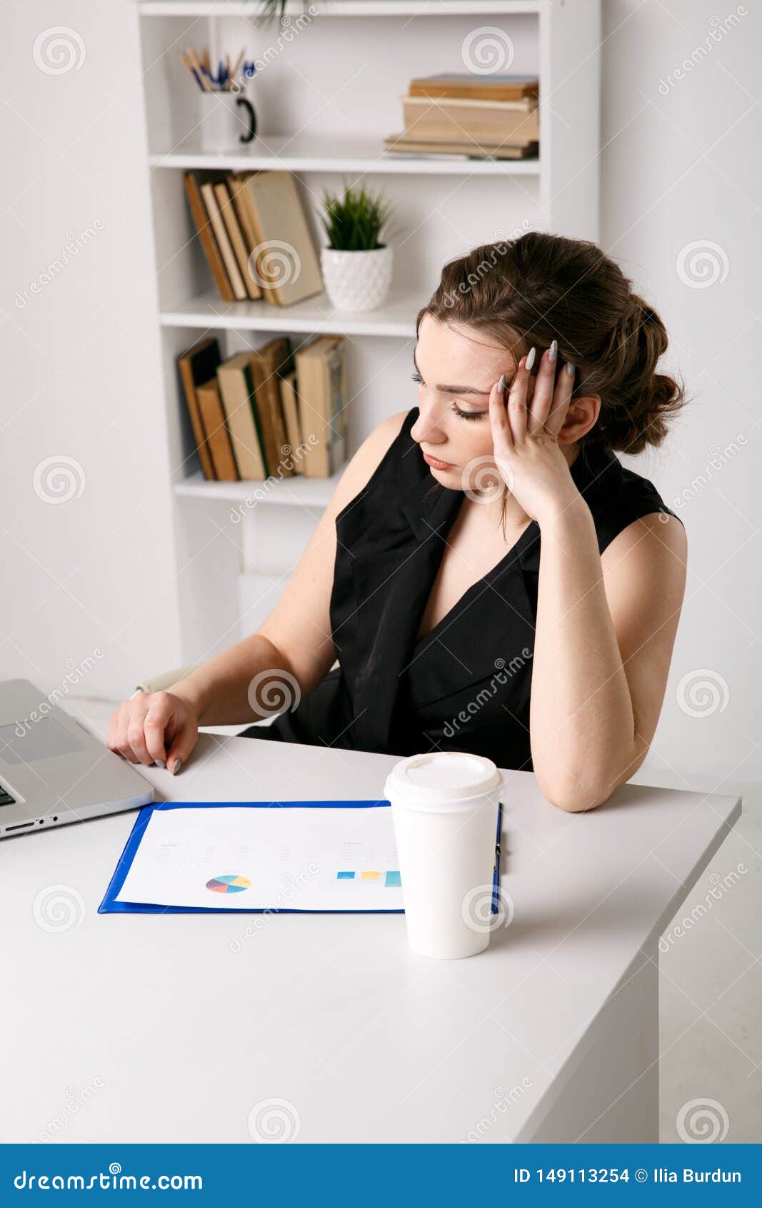 Tired Sad Woman in Stress Sitting at Her Workplace and Working on the ...