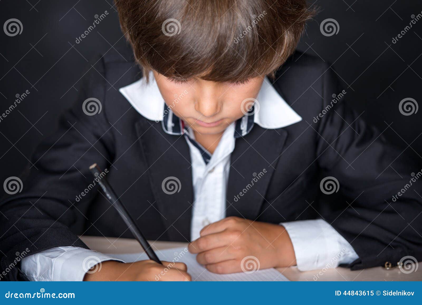 Tired School Boy Writing in Notebook Stock Image - Image of studying ...