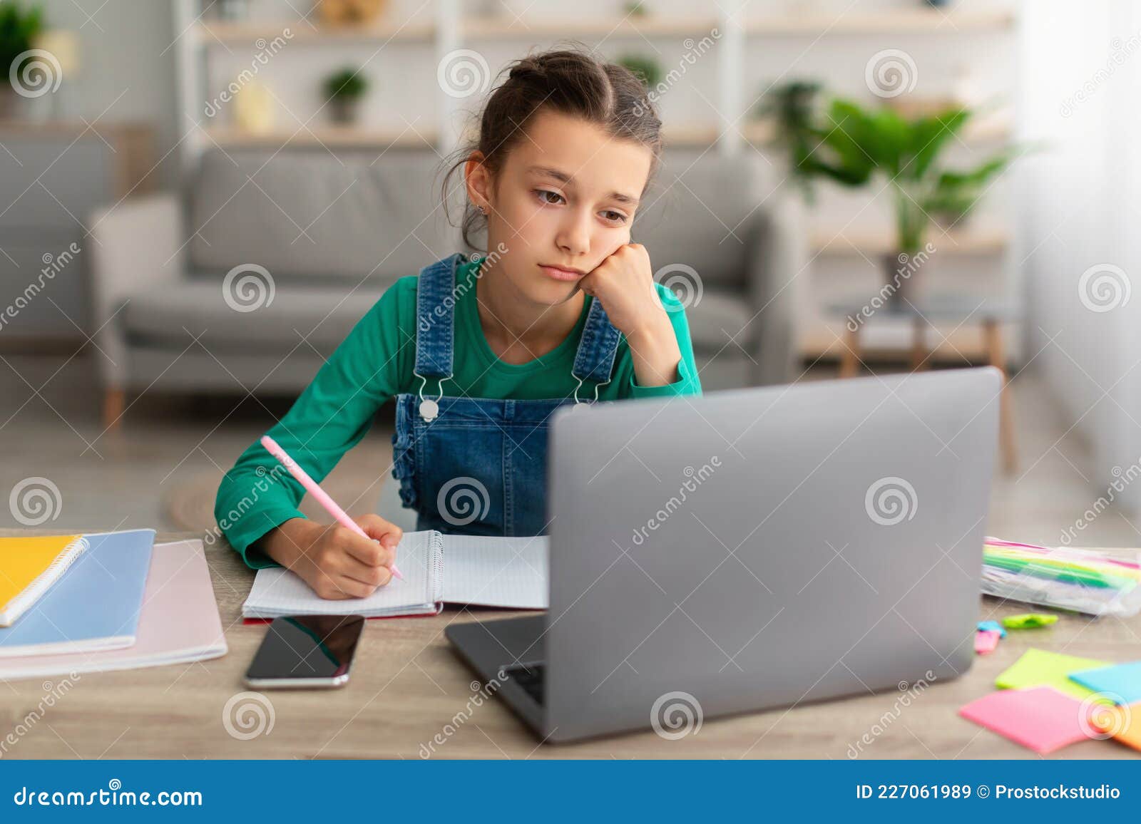 Tired School Girl Writing in Notebook Doing Homework Stock Image ...