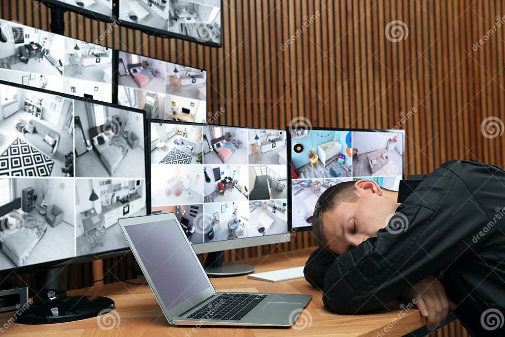 Tired Security Guard Sleeping at Workplace in Office Stock Image ...