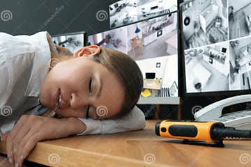 Tired Security Guard Sleeping at Workplace Stock Photo - Image of ...