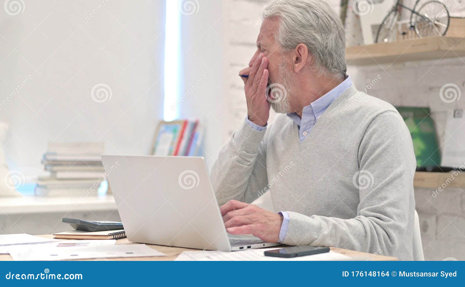 Tired Senior Old Man Yawning while Using Laptop Stock Photo - Image of ...