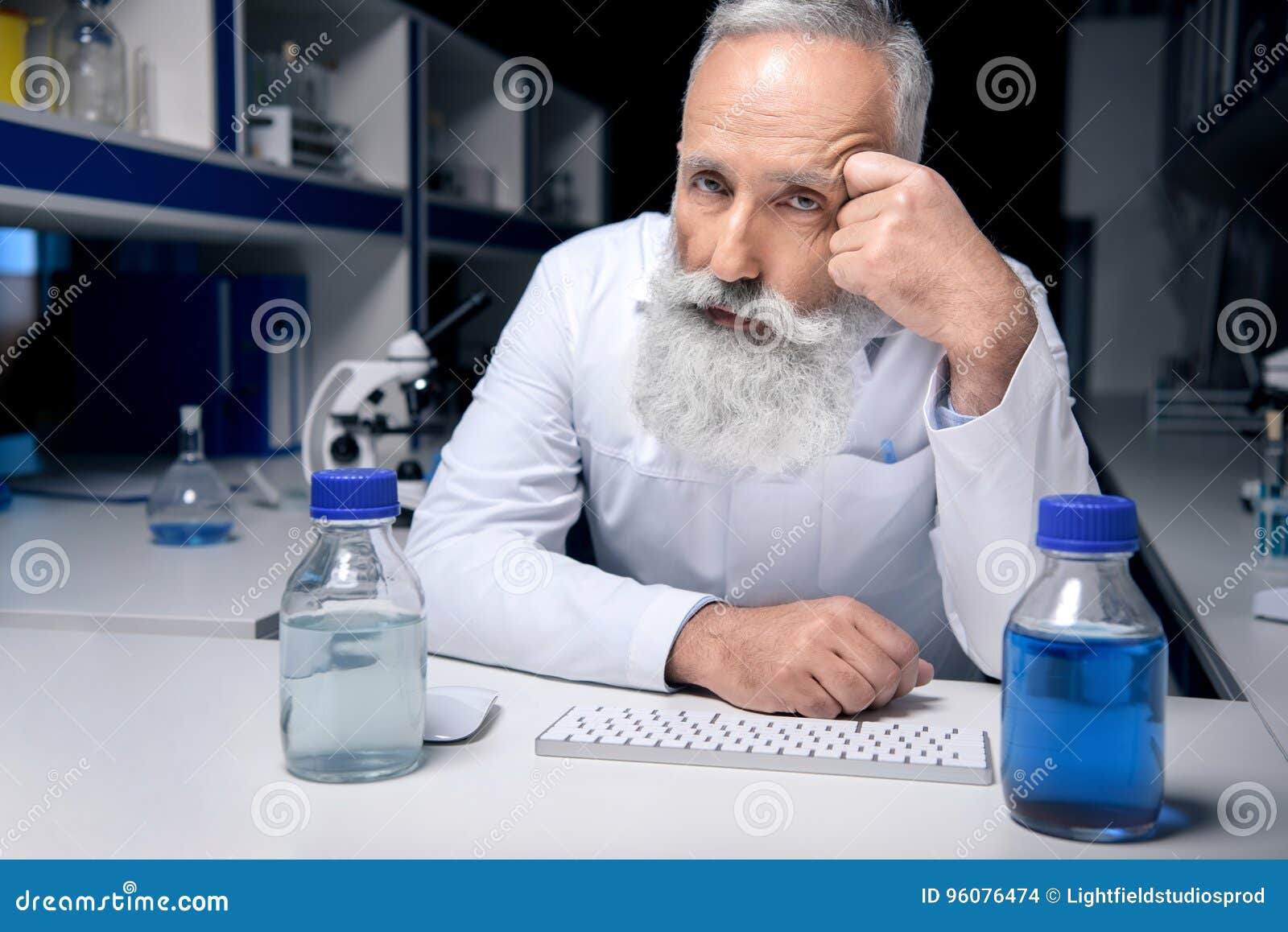 Tired Senior Scientist Sitting at Workplace and Looking at Camera Stock ...