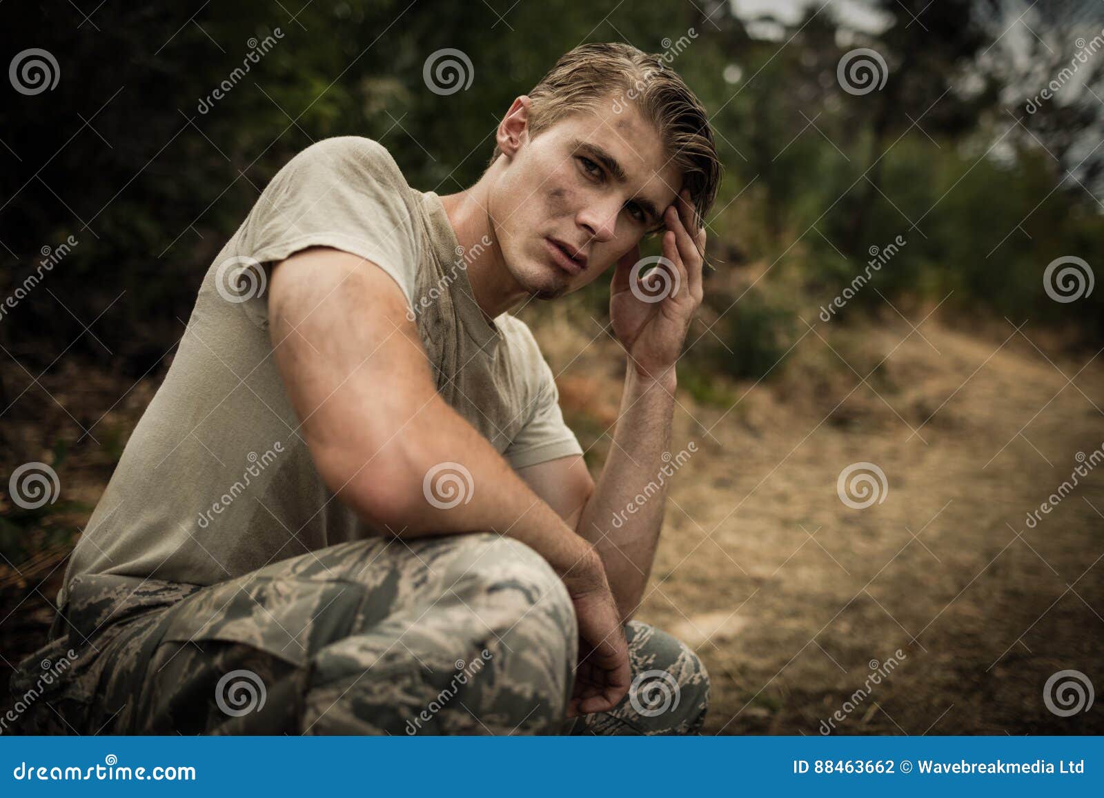Tired Soldier with Hand on Head Sitting in Boot Camp Stock Photo ...