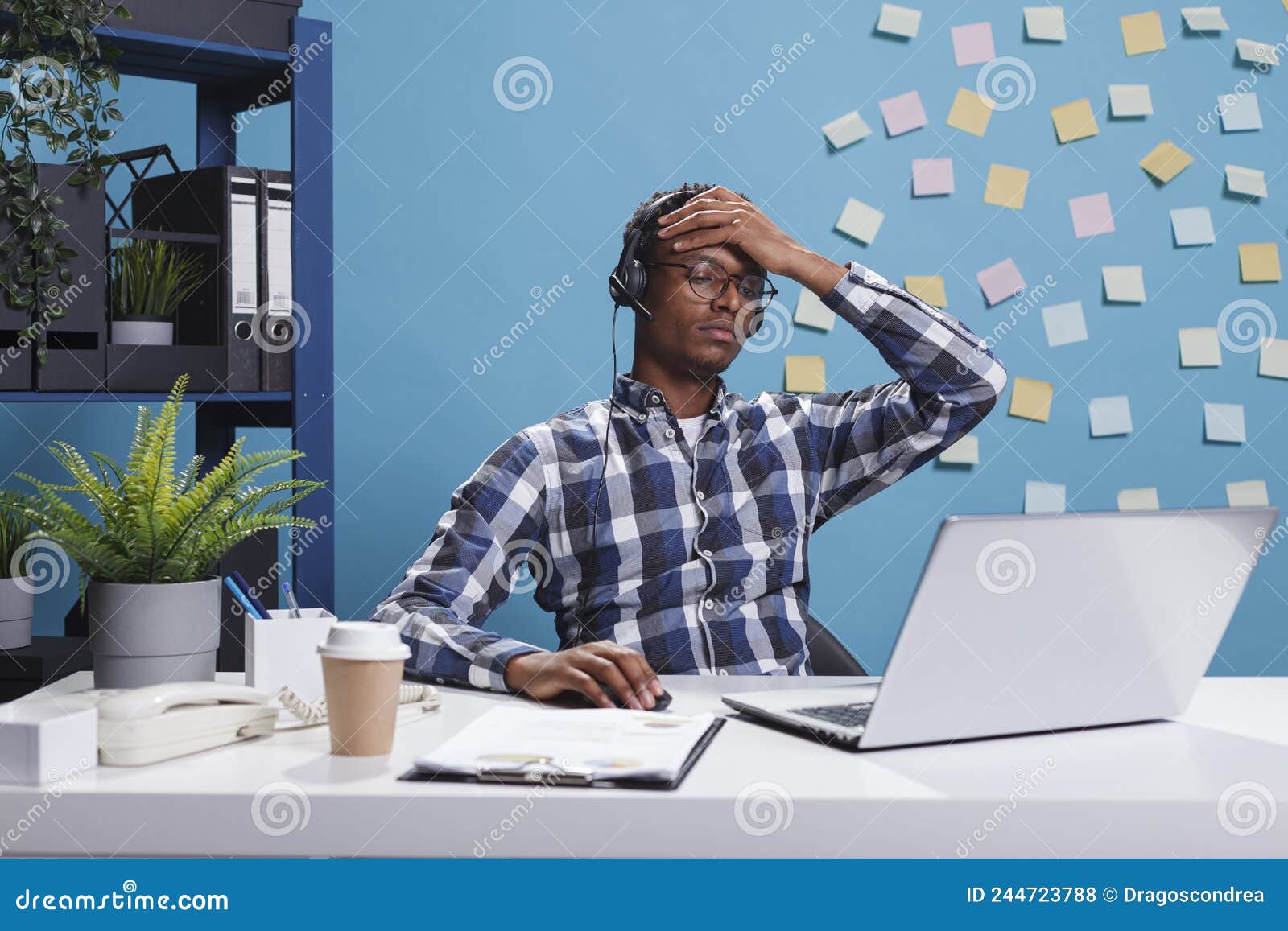 Tired and Stressed Customer Support Operator with Headache in ...