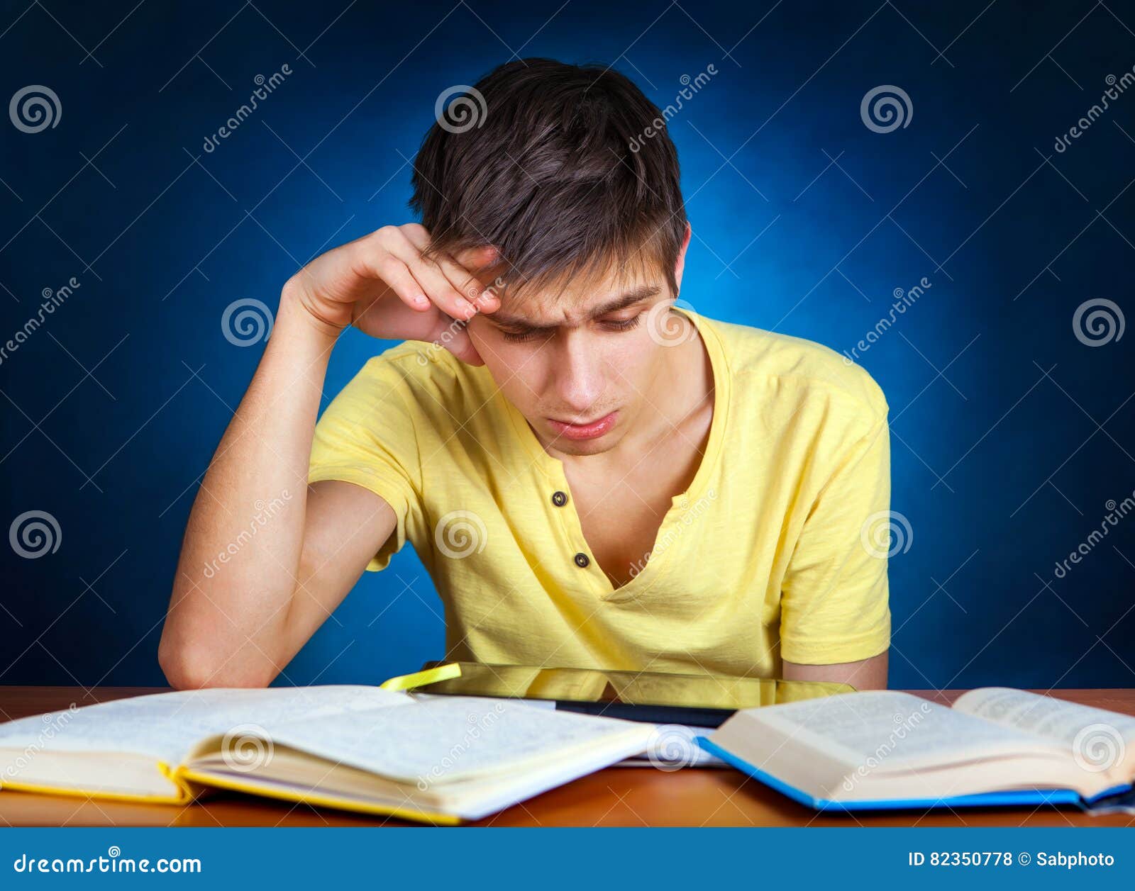 Tired Student with a Books stock photo. Image of overwork - 82350778