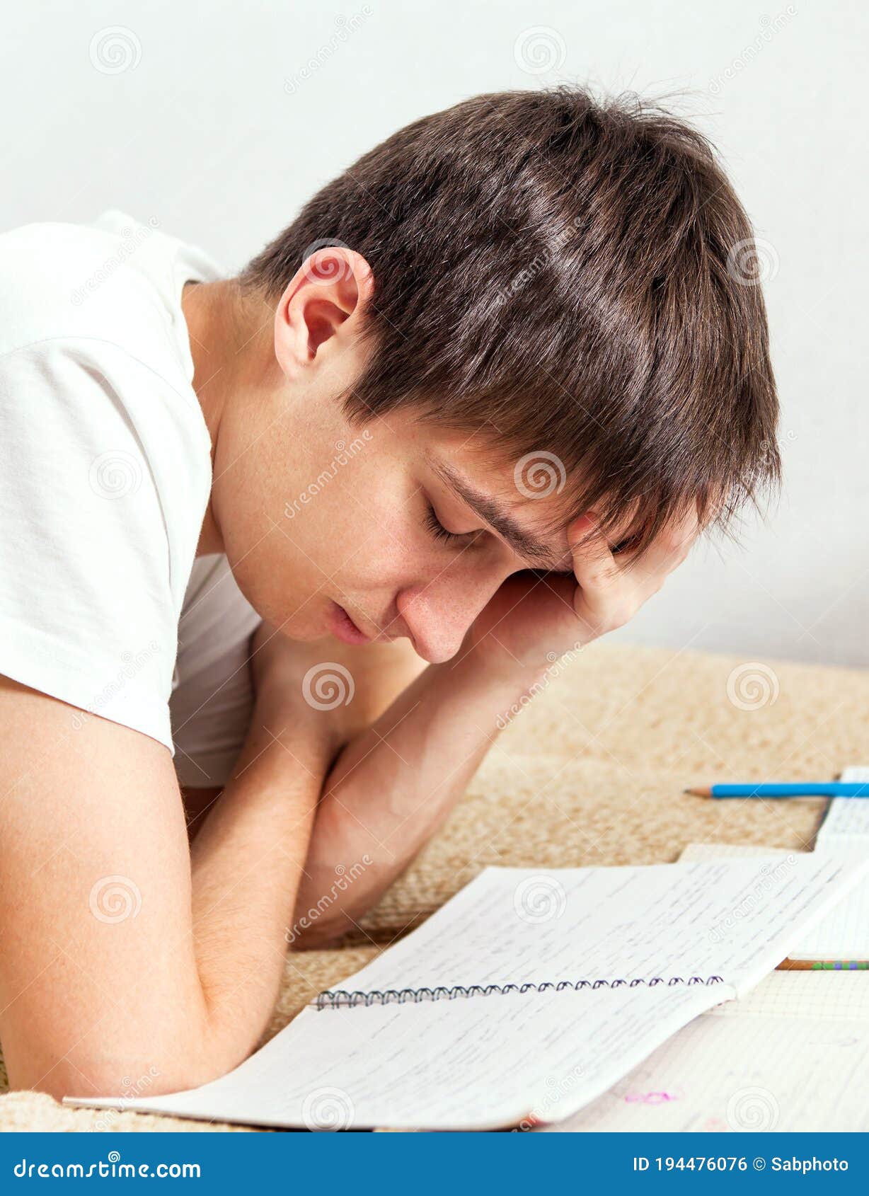 Tired Student working stock photo. Image of teen, indoor - 194476076