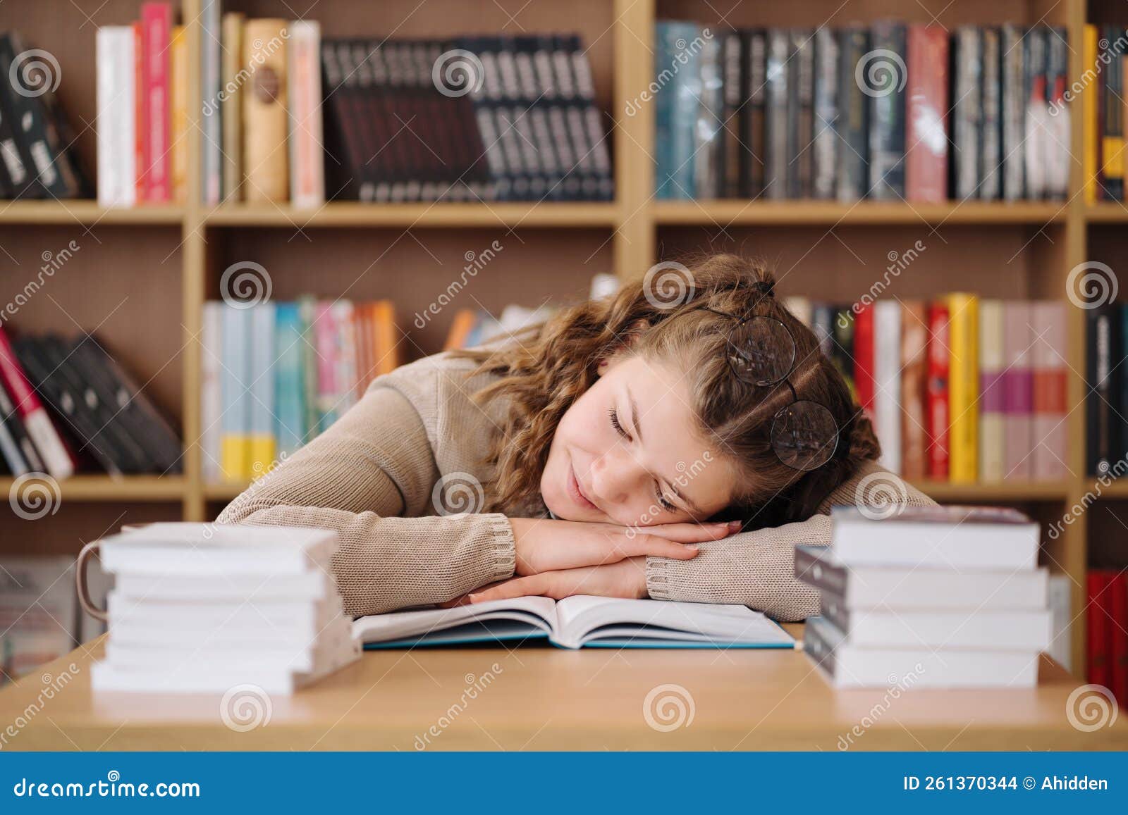 Tired Student Got Asleep on the Desk while Studying among Books Stock ... Tired Student Got Asleep on the Desk while Studying among Books Stock ...