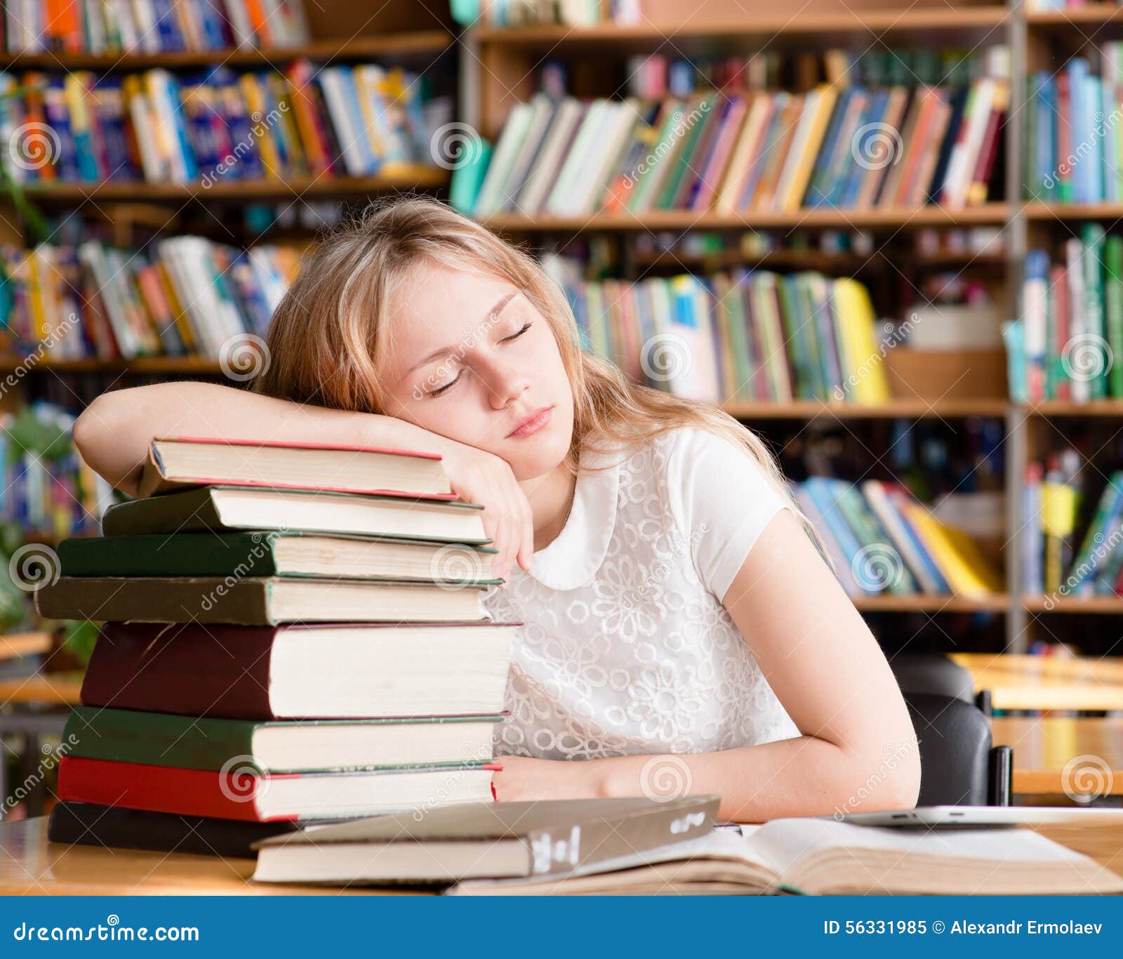 The Tired Student Sleeps in Library on Pile Books Stock Image - Image ...
