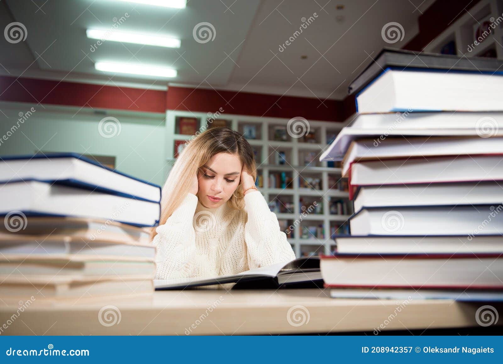 A Tired Student is Studying in the School Library. Stock Image - Image ...