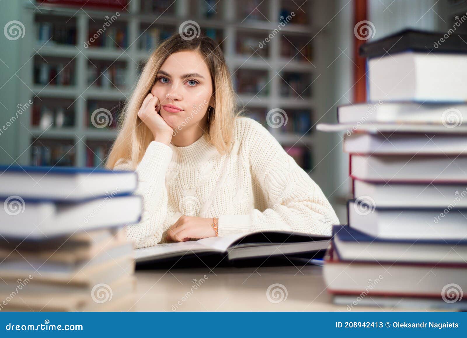 A Tired Student is Studying in the School Library. Stock Image - Image ...