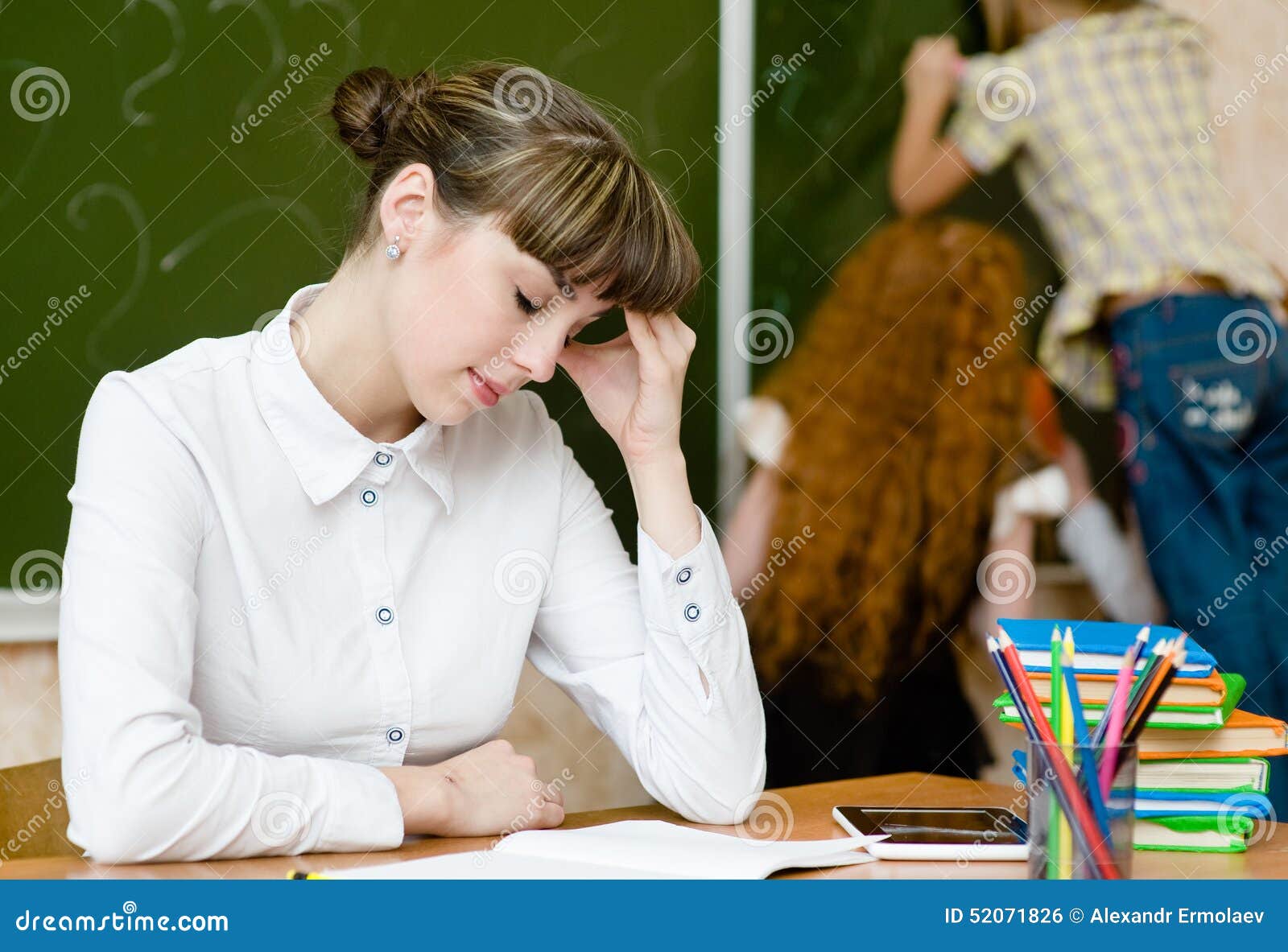 Tired teacher in classroom stock photo. Image of blackboard - 52071826