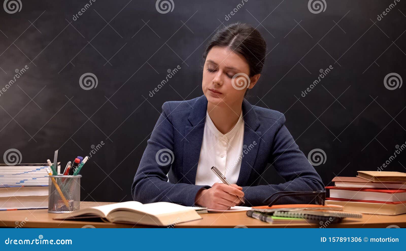 Tired Teacher Preparing for Next Lesson Writing Plan and Additional ...