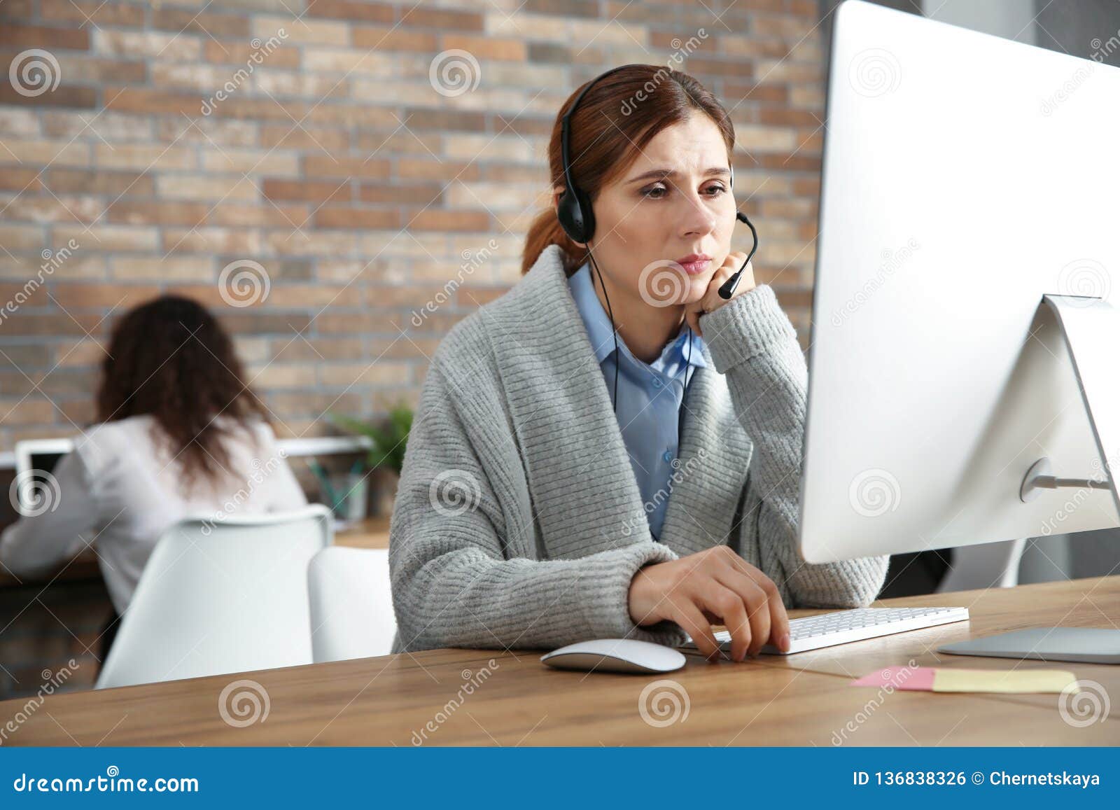 Tired Technical Support Operator Working at Table Stock Photo - Image ...