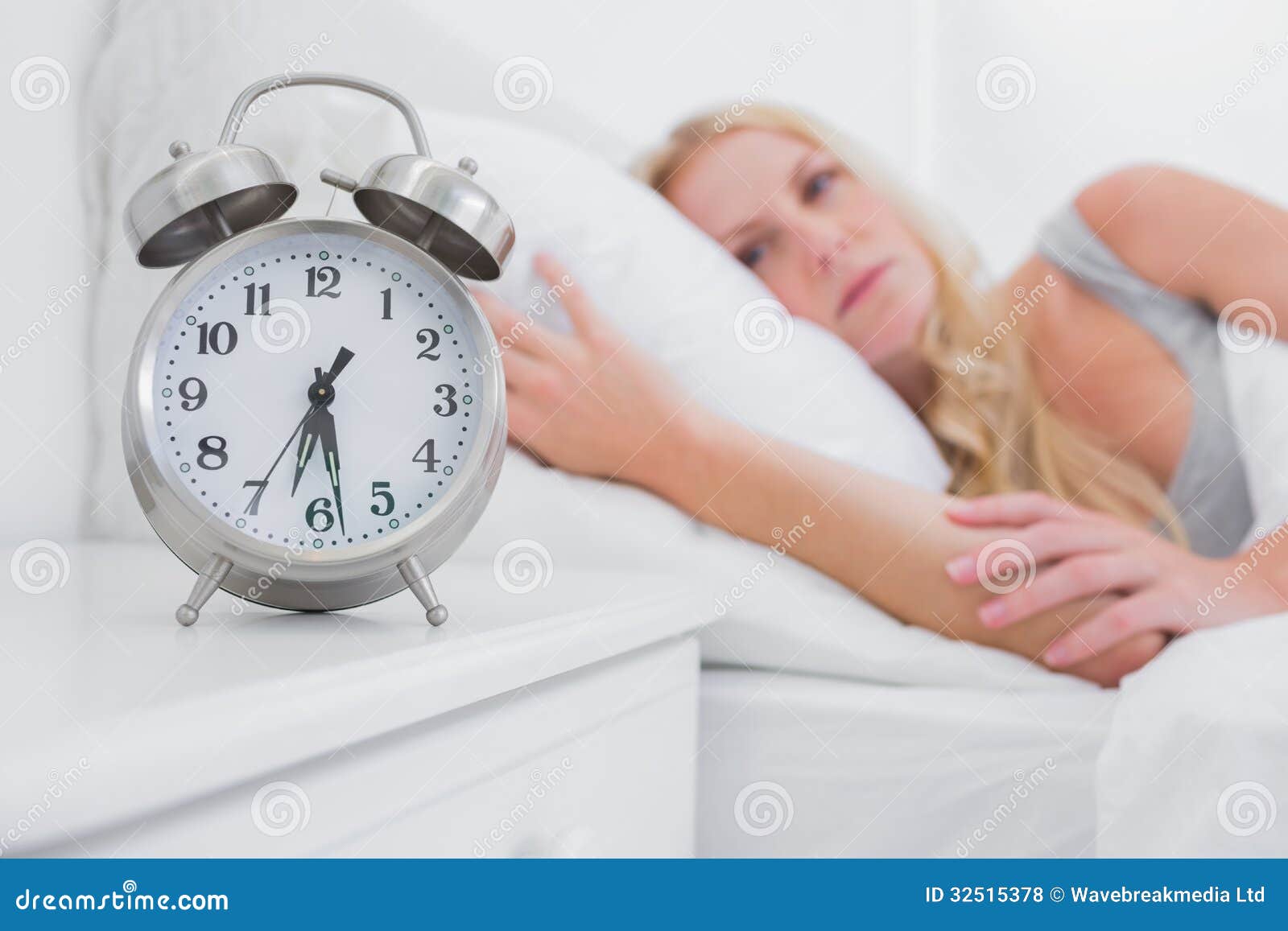 Tired Woman Looking at the Alarm Clock Stock Photo - Image of bedside ...