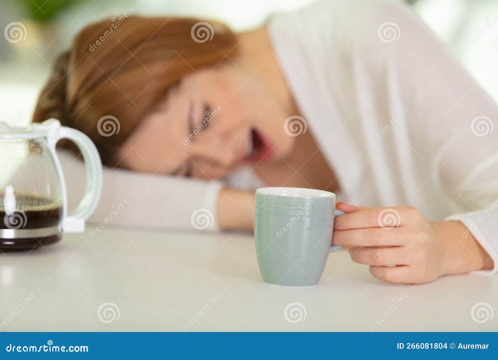 Tired Woman Sleeping on Kitchen Table Drinking Coffee Stock Photo ...