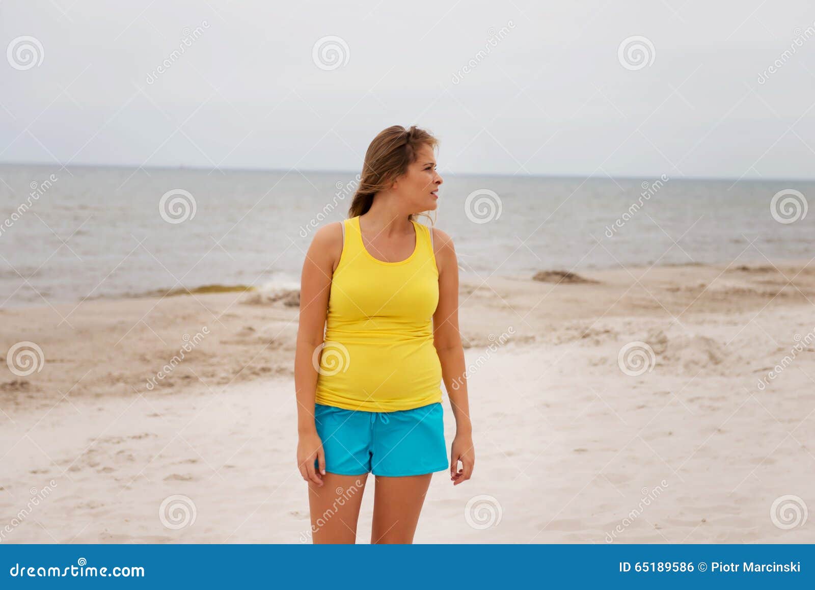 Tired Woman Standing on the Beach Stock Photo - Image of holidays, hand ...