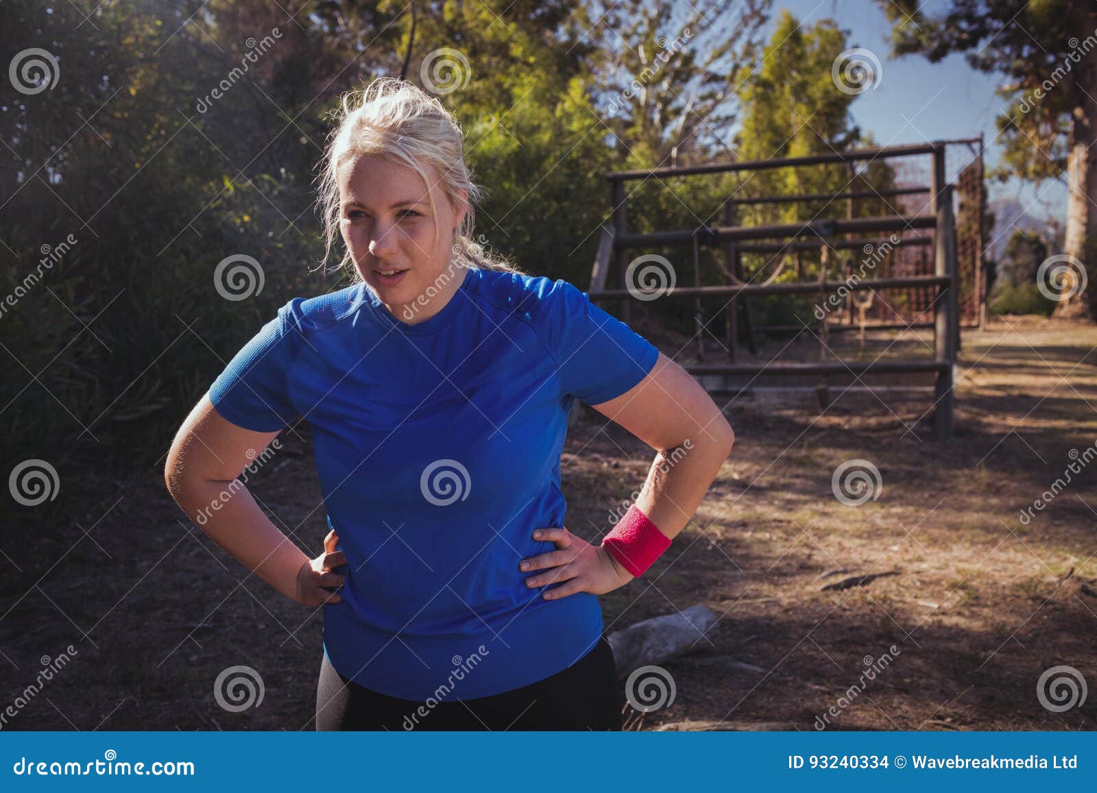 Tired Woman Standing with Hands on Hip in the Boot Camp Stock Photo ...