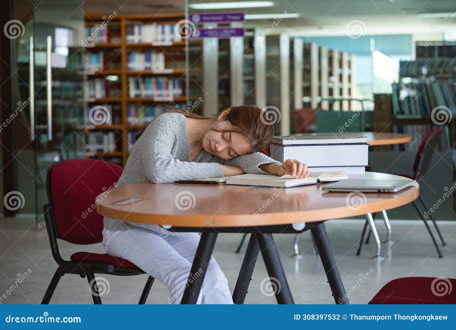 Tired Woman Student Sleeping on Desk in Library Stock Photo - Image of ...