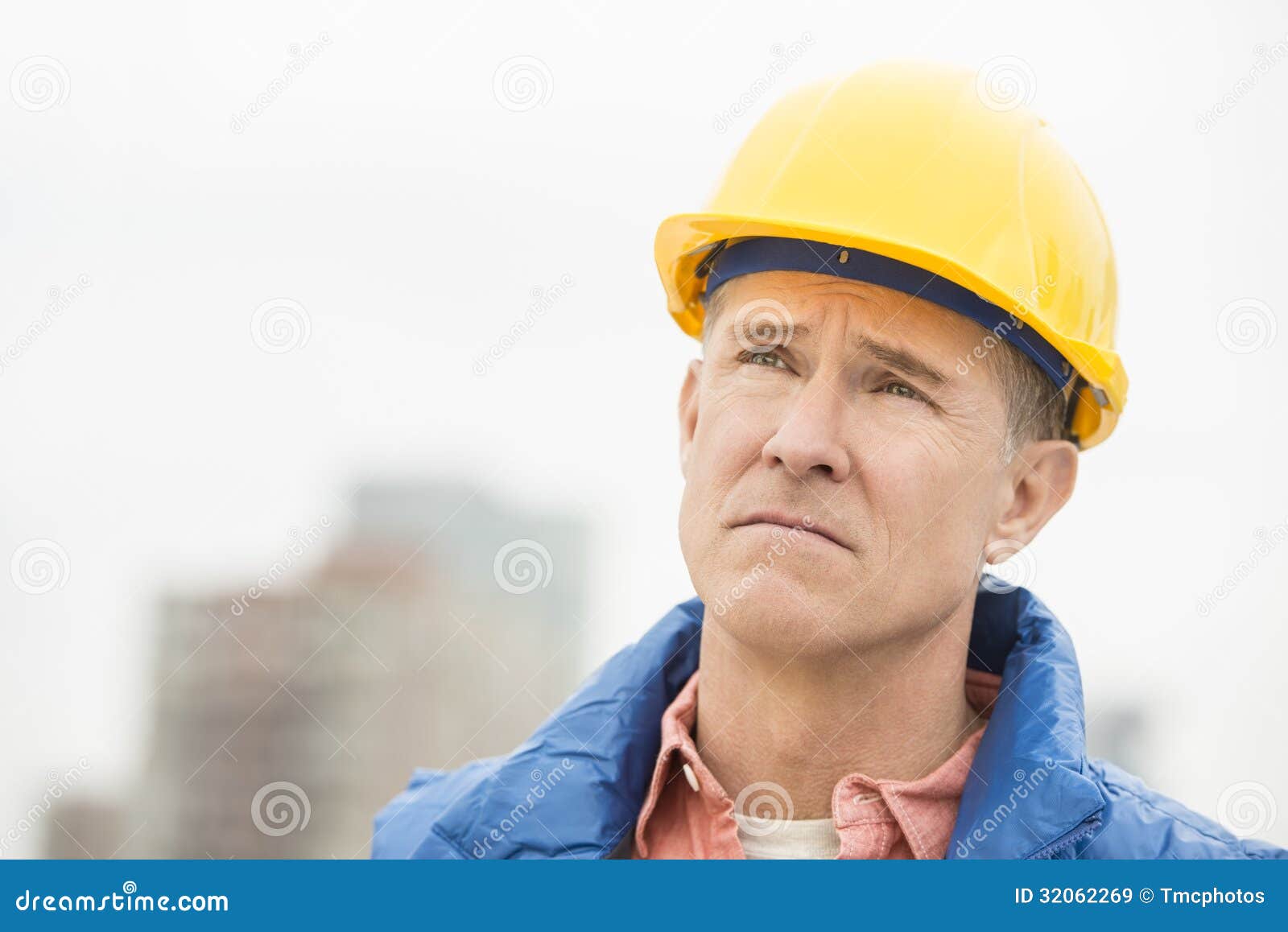 Tired Worker Looking Away at Construction Site Stock Image - Image of ...