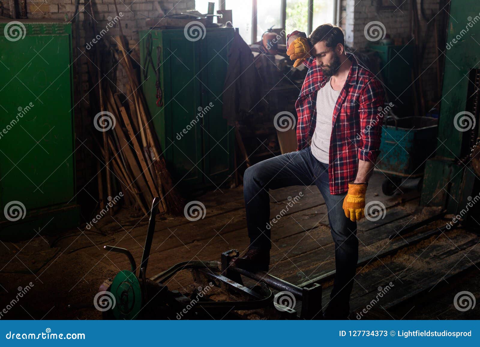 Tired Worker Wiping Forehead and Standing Near Machine Stock Image ...